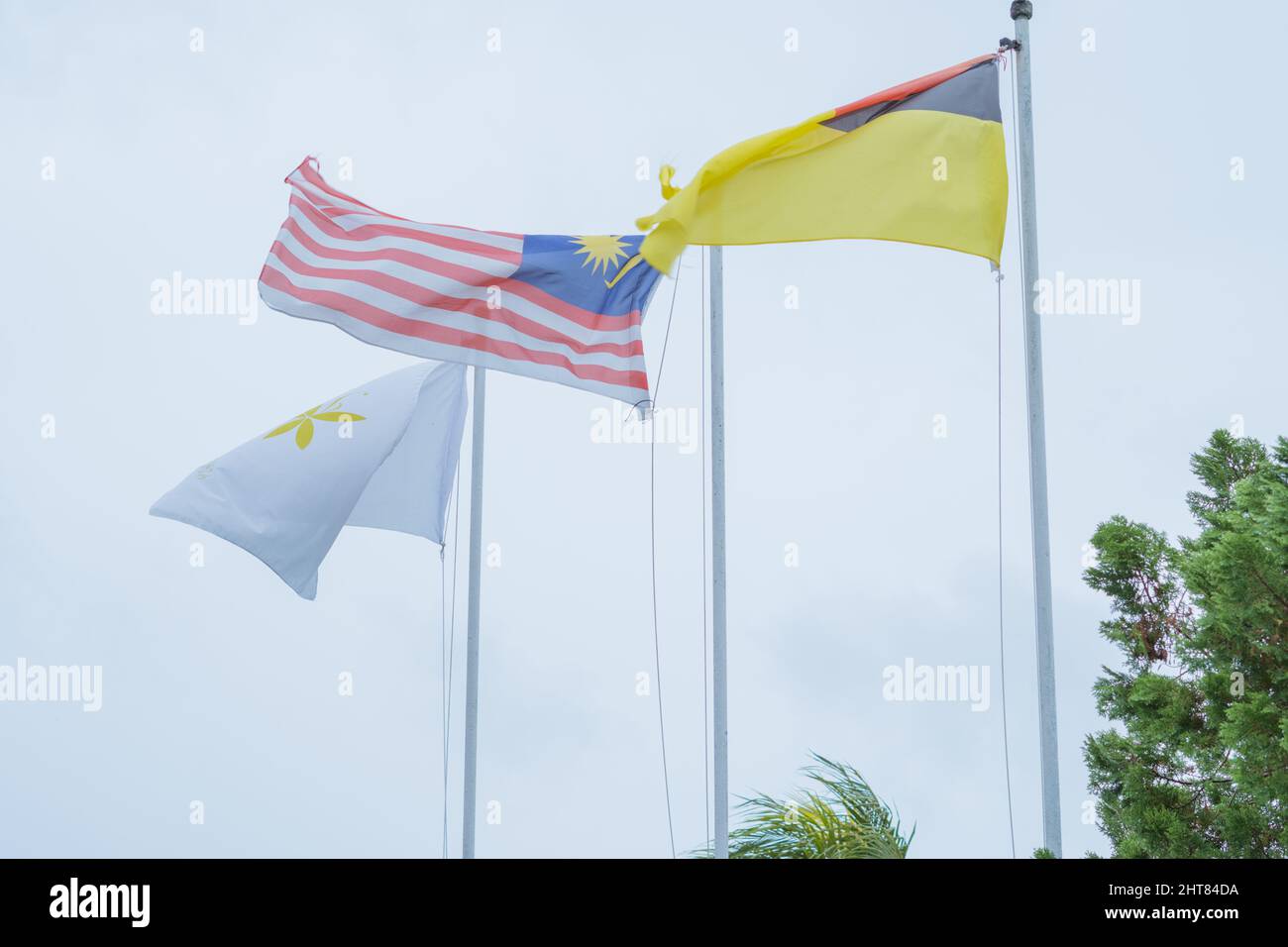 Closeup of Flags waving over a hotel in Port Dickson city, Negari ...