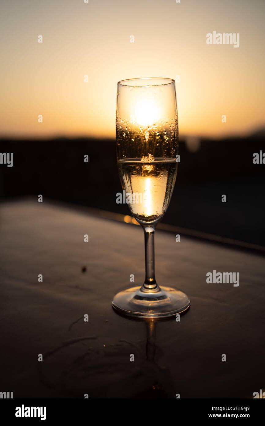 Glass of champaign against the sunset sky Stock Photo - Alamy