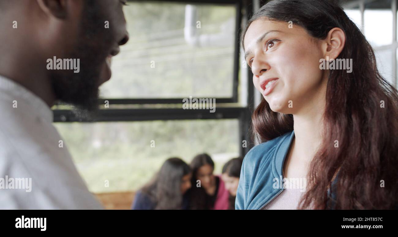 Female talking with her friends with a serious face Stock Photo - Alamy