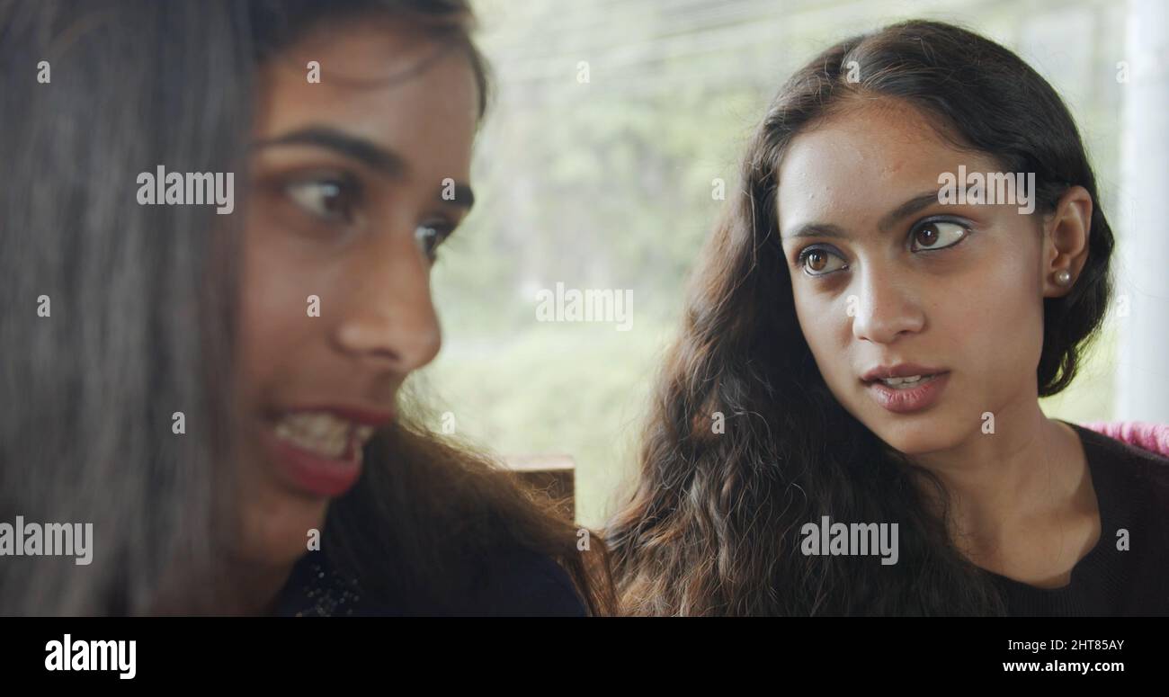 Couple of Indian young people having a conversation with angry gestures ...