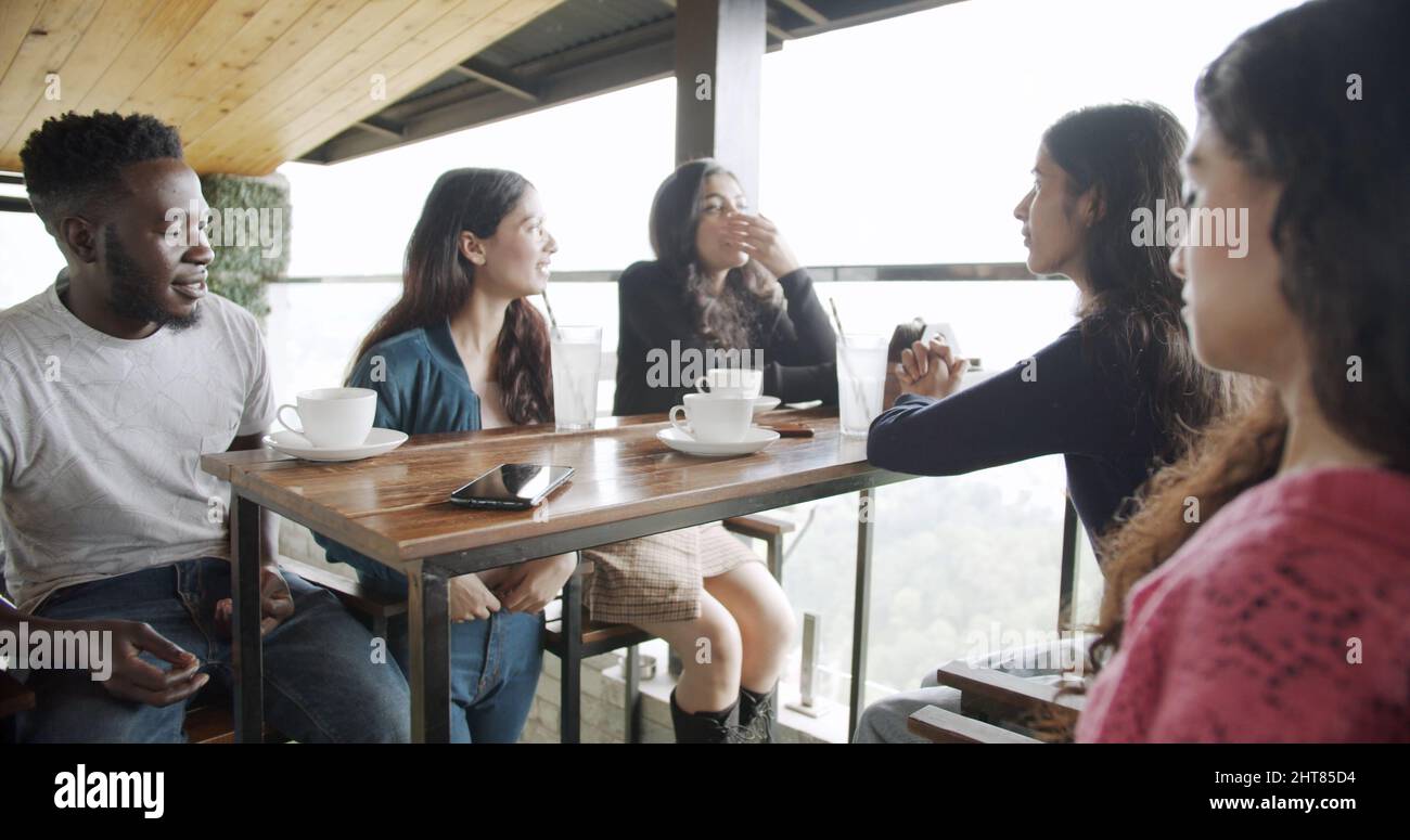 Group of Indian young people talking to each other inside a cafe Stock ...
