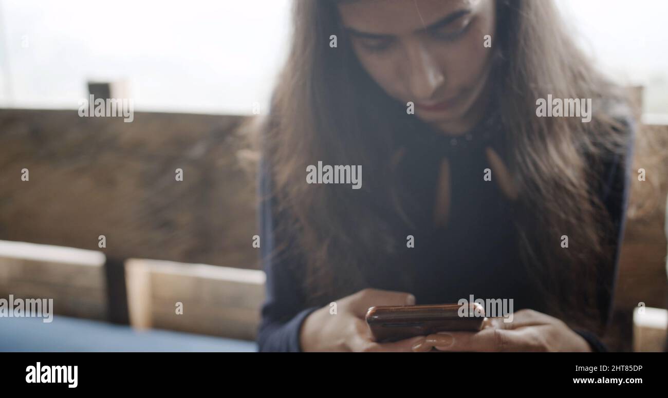 Close-up of a young South Asian girl scrolling on her phone Stock Photo ...
