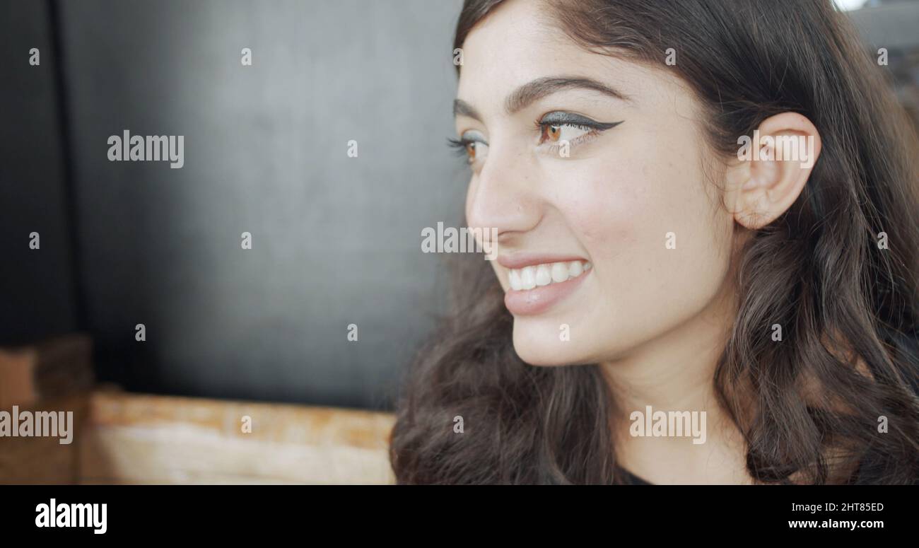 Indian female looking at something with a beautiful smile Stock Photo ...