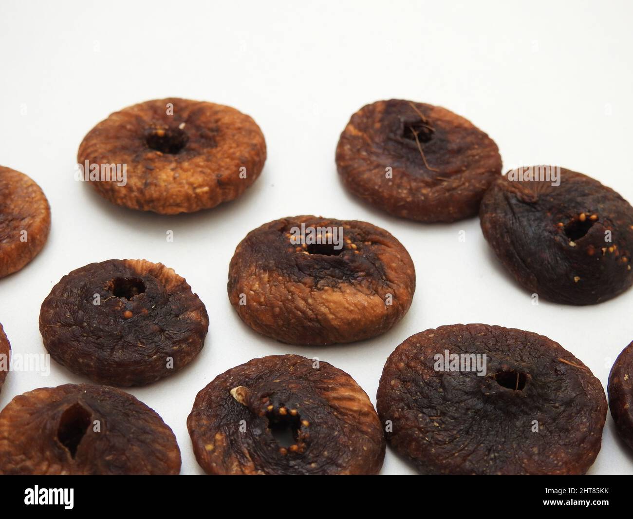 Closeup of sweet dry fig fruit isolated white background Stock Photo ...