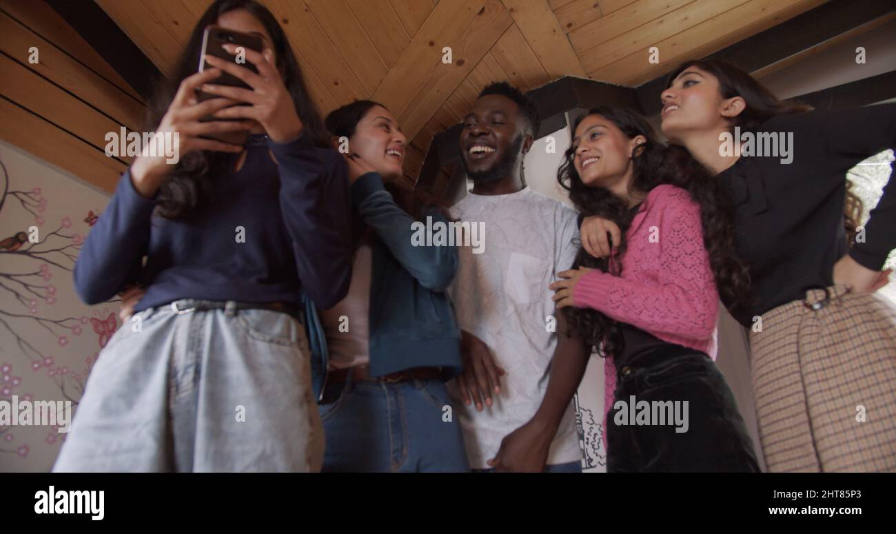 Group of young happy smiling friends taking a selfie together Stock ...