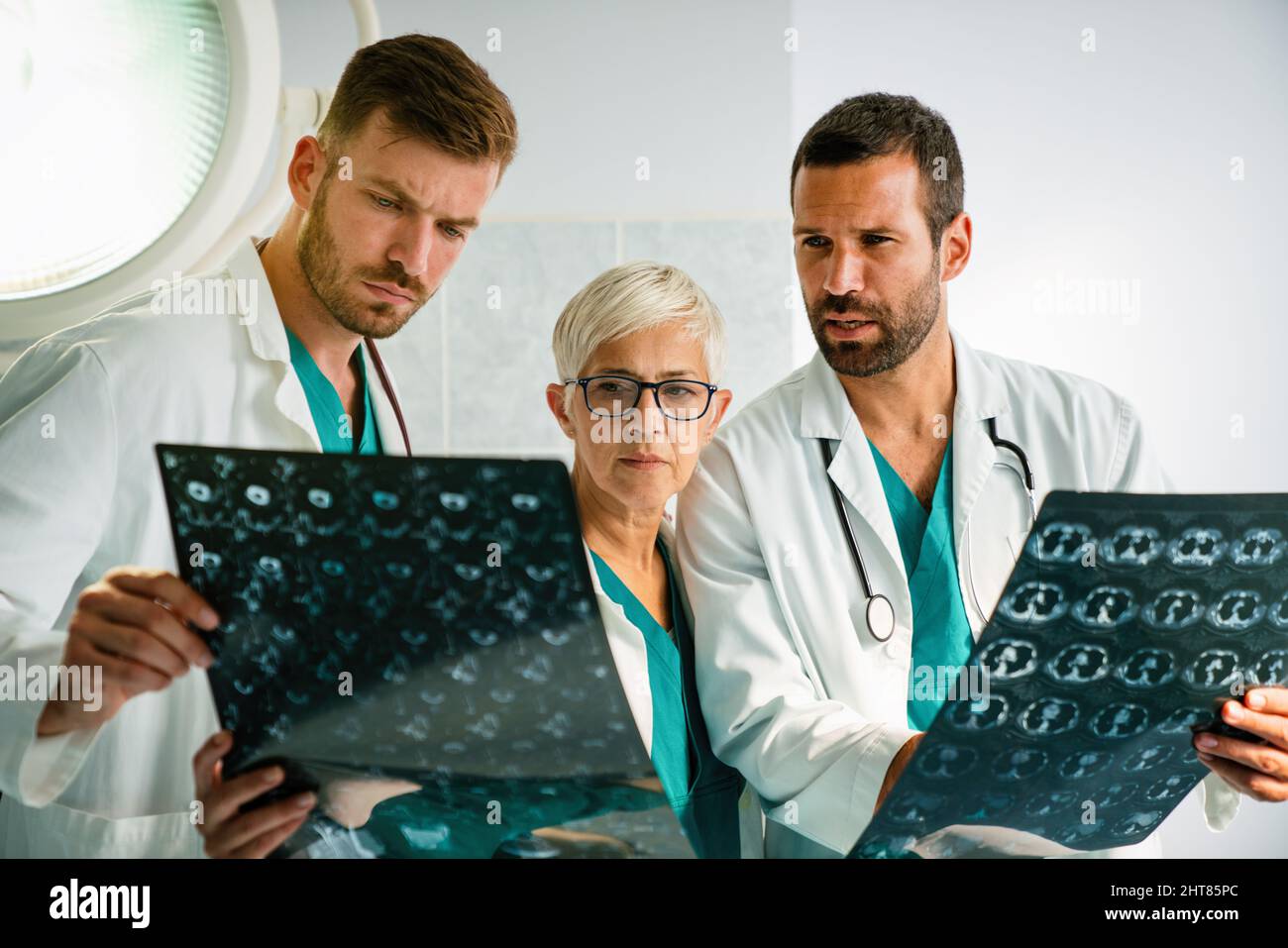 Group of doctors checking x-rays in a hospital Stock Photo - Alamy