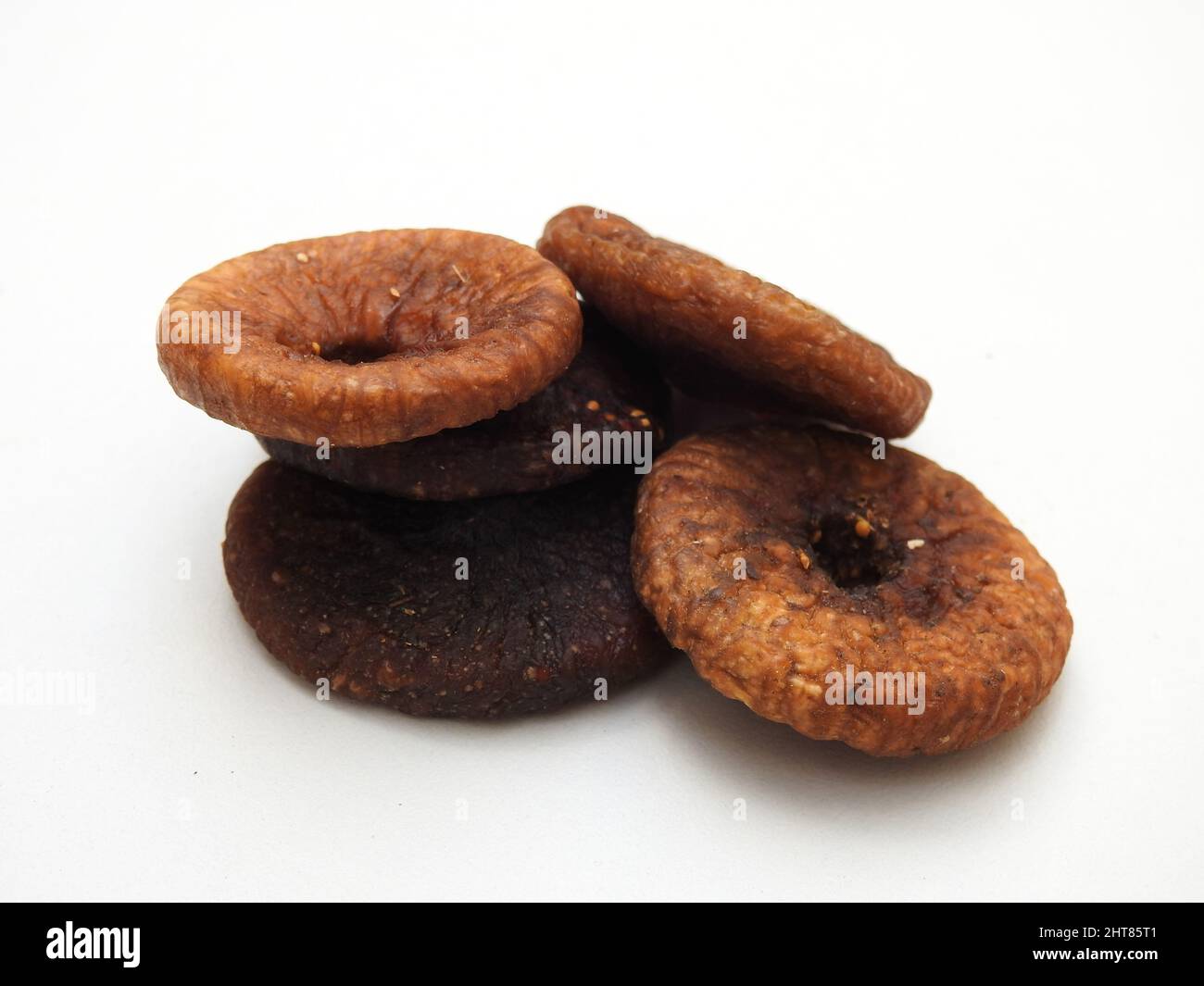 Closeup of sweet dry fig fruit isolated white background Stock Photo ...