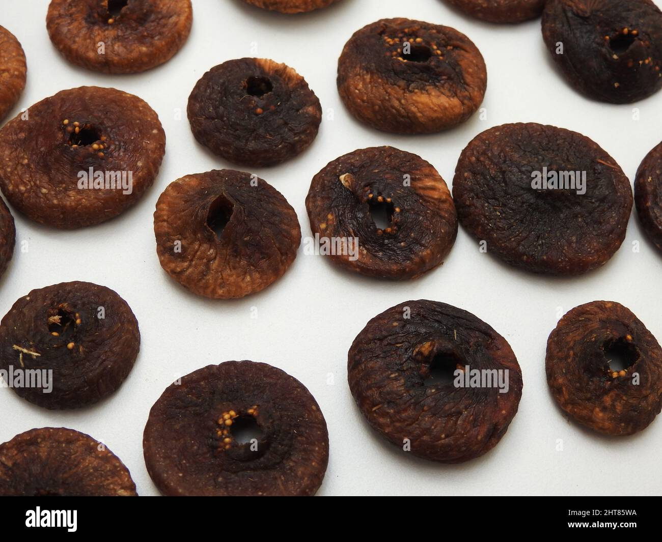 Closeup of sweet dry fig fruit isolated white background Stock Photo ...