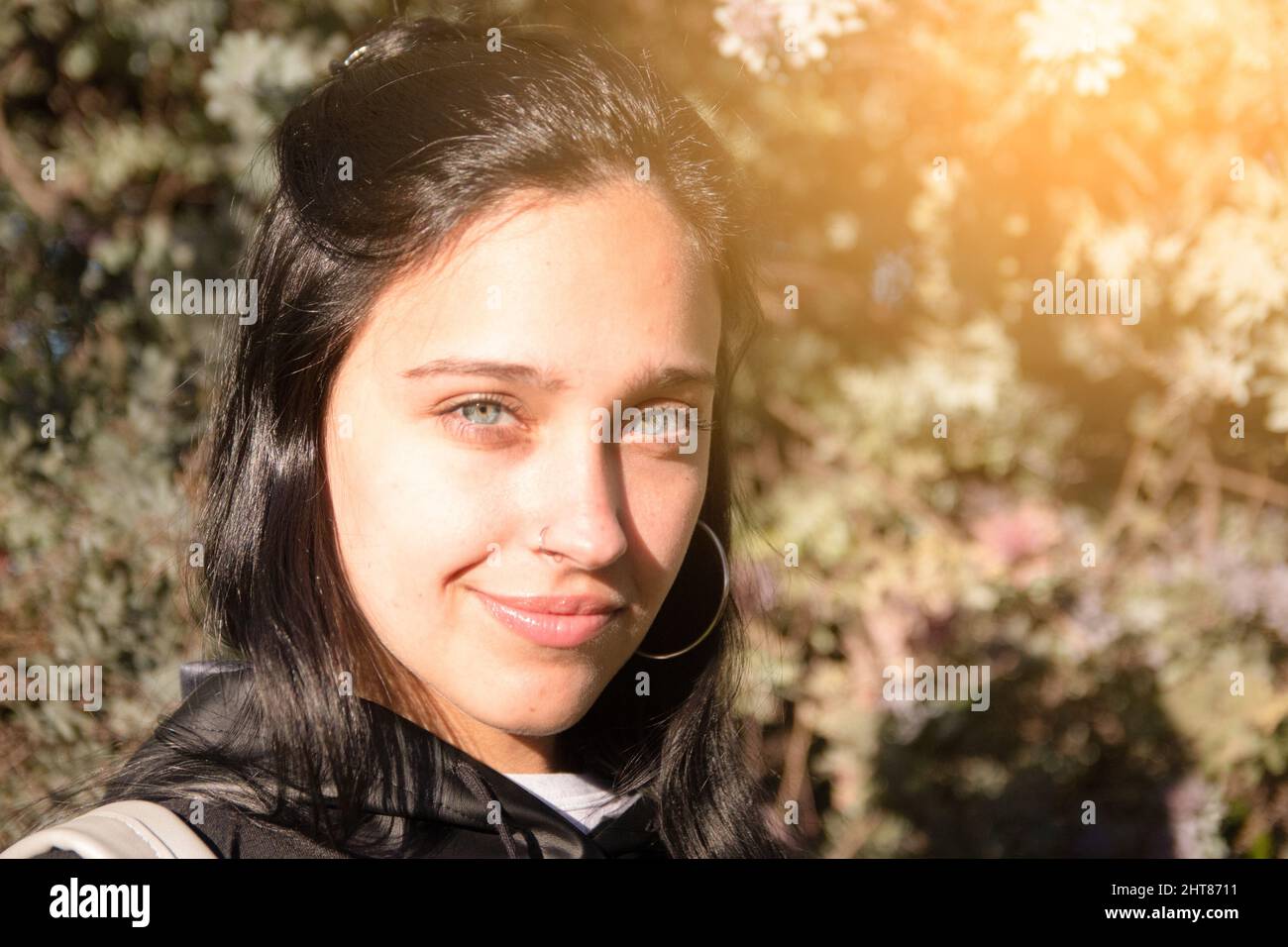 Beautiful Hispanic female with blue eyes looking at the camera Stock ...