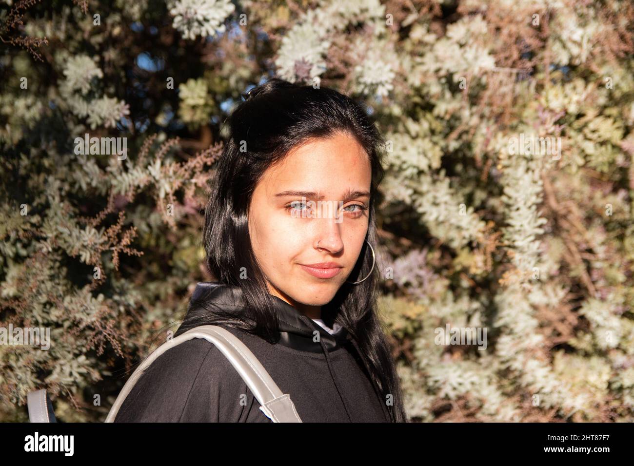 Beautiful Hispanic female with blue eyes looking at the camera Stock ...