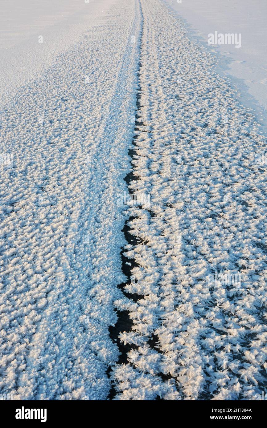Beautiful effect - snow stars on ice. A pattern that forms only in ...