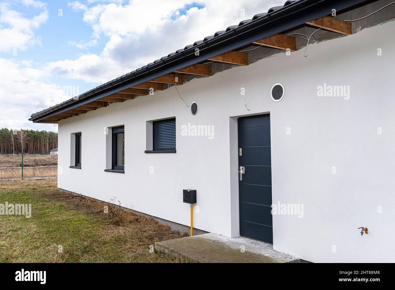 Air intake and exhaust in the wall of a single family house for ...