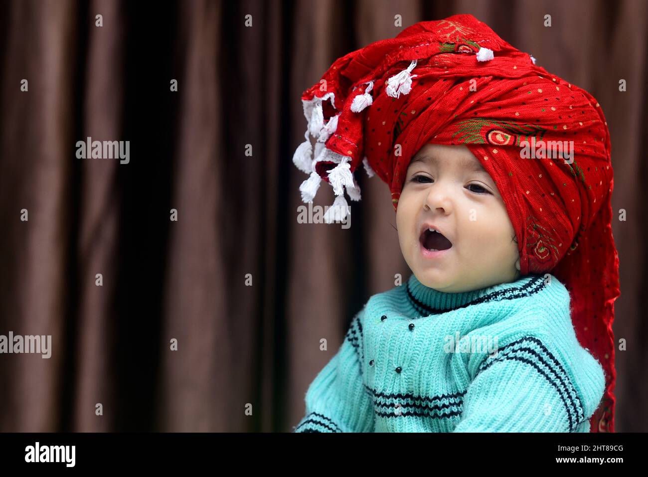 Portrait of an adorable Indian child wearing a red turban Stock Photo ...