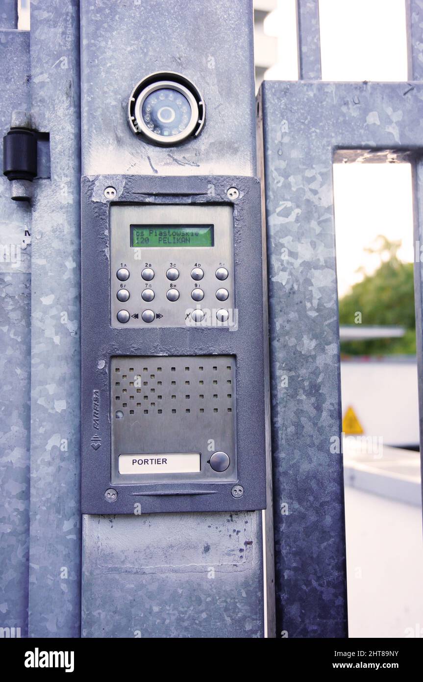 Closeup of an Intercom system with keys by a locked gate Stock Photo ...