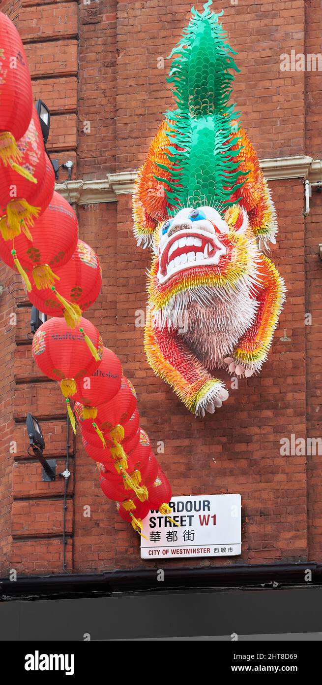 Tiger decoration above the street sign for Wardour Street, Chinatown ...