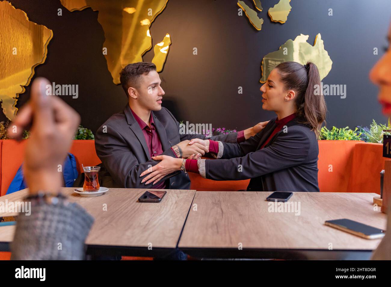Two amazing and attractive business people are making a deal Stock ...