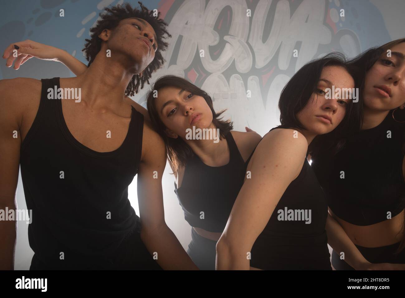 Group of multiracial dancers are exercising and practicing in their ...