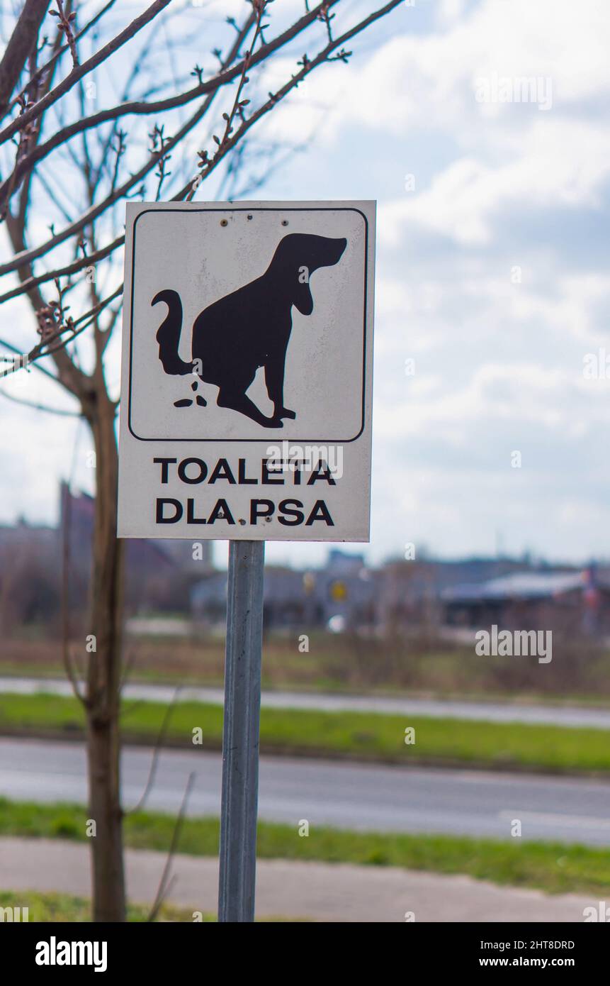 Closeup of a dog toilet sign on a metal pole Stock Photo - Alamy