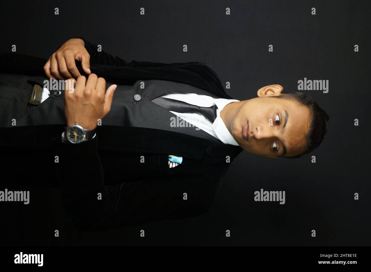 Closeup of a man posing for a photo in a studio Stock Photo - Alamy
