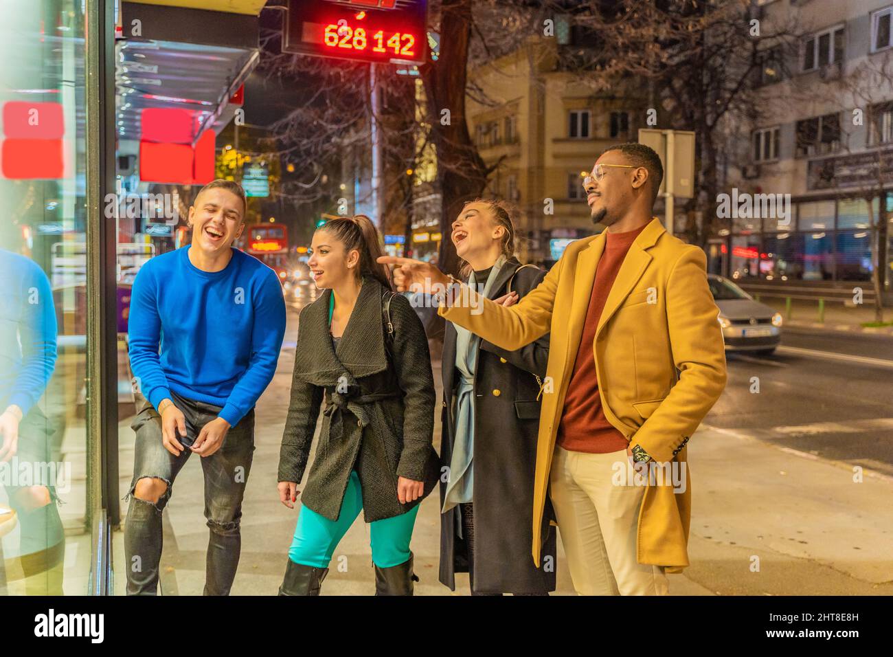 Group of multiracial best friends are laughing all together in front fo ...