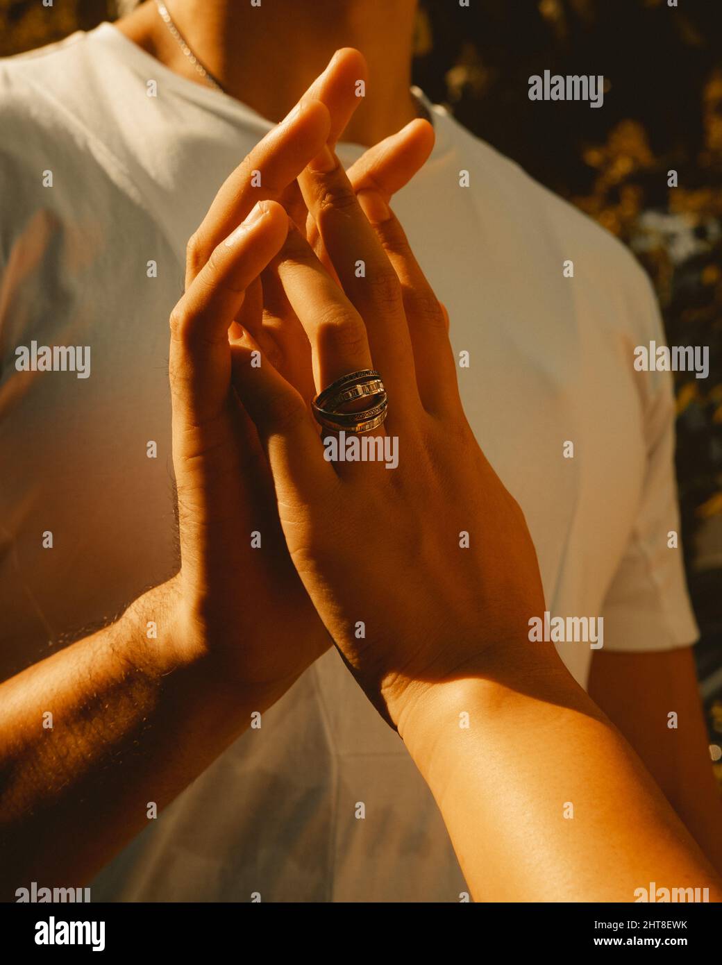 Closeup of hands with a ring Stock Photo - Alamy