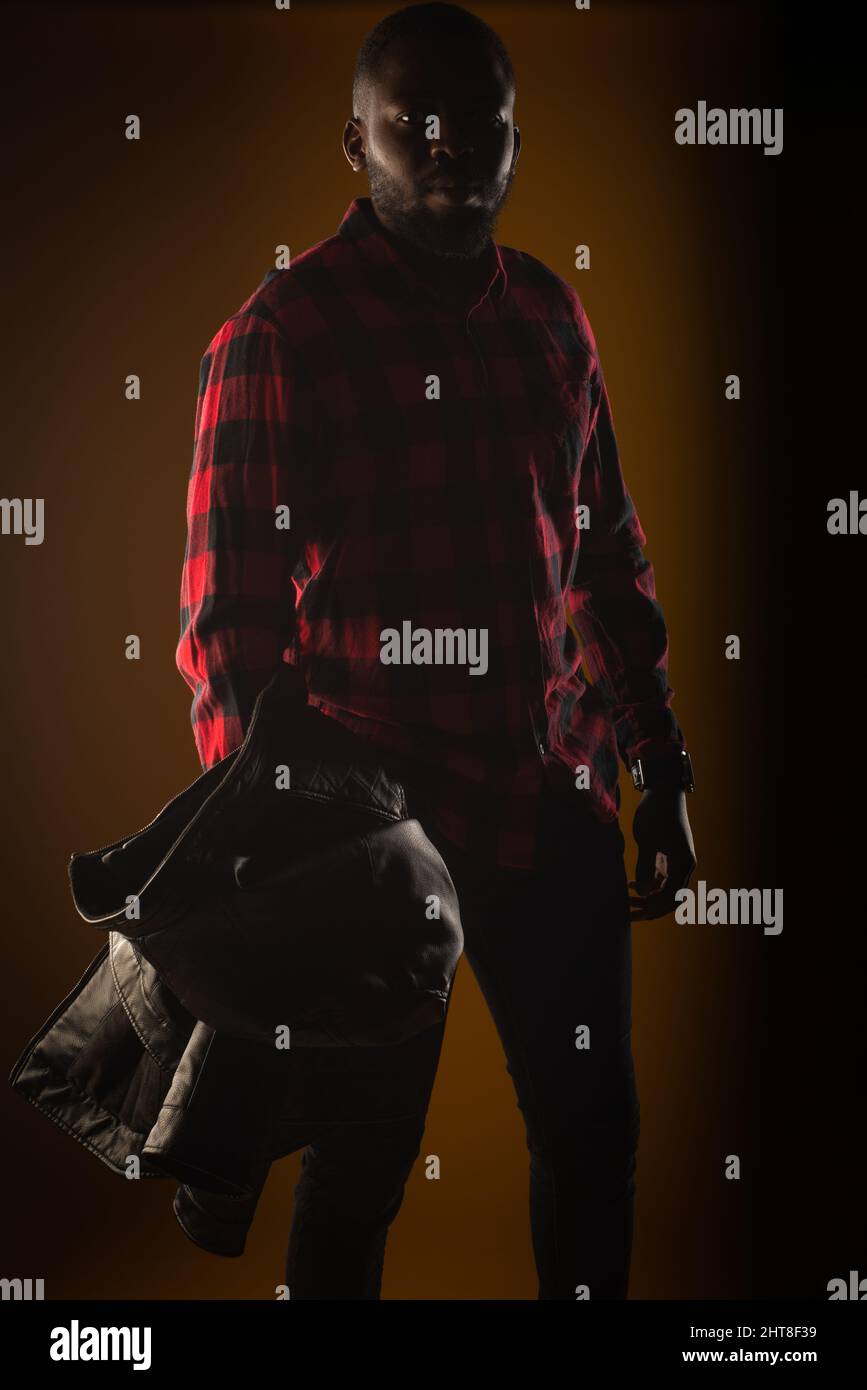 Handsome black male is posing with a great posture Stock Photo - Alamy