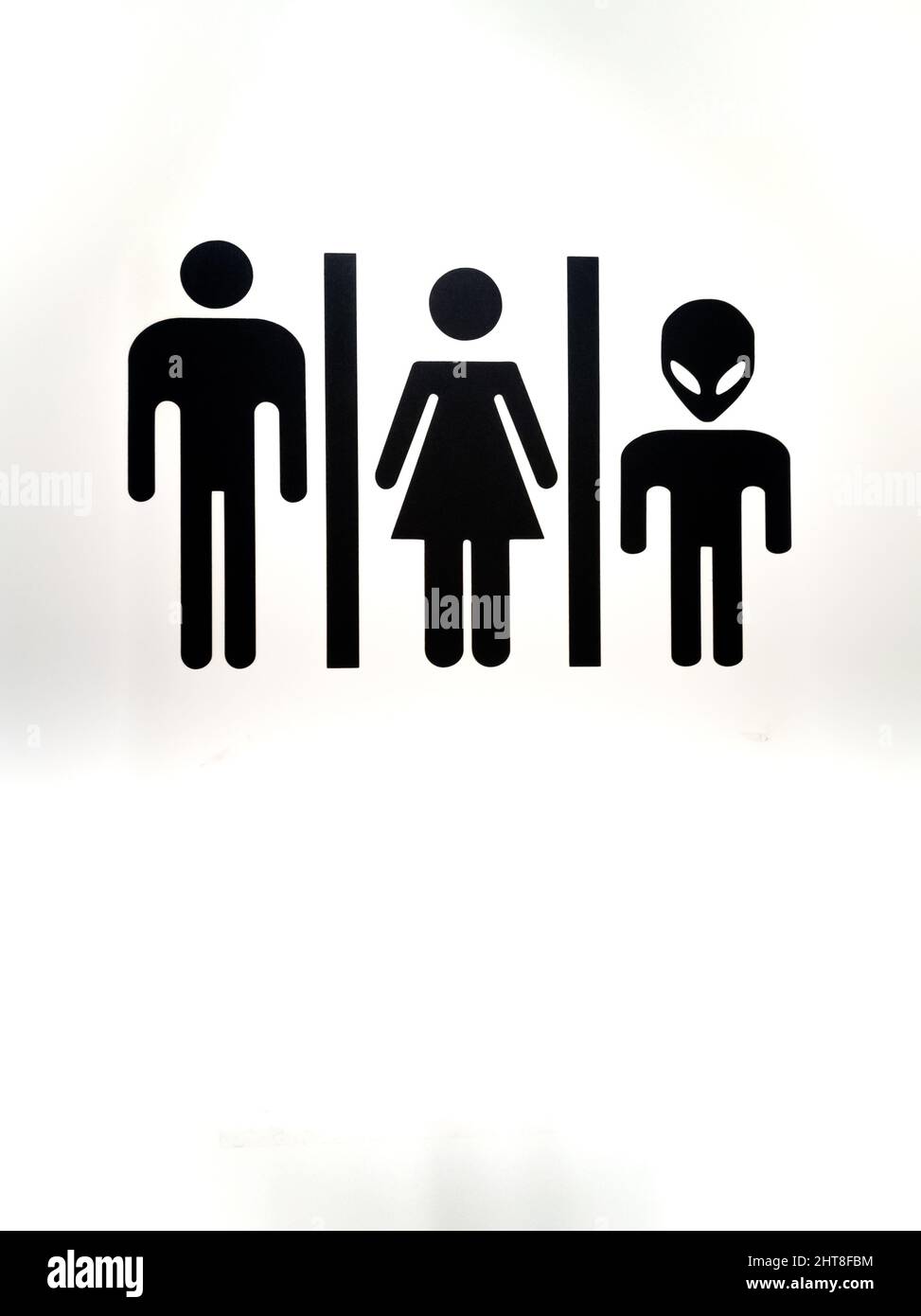 Restroom sign with male, female, and alien figures isolated on a white ...