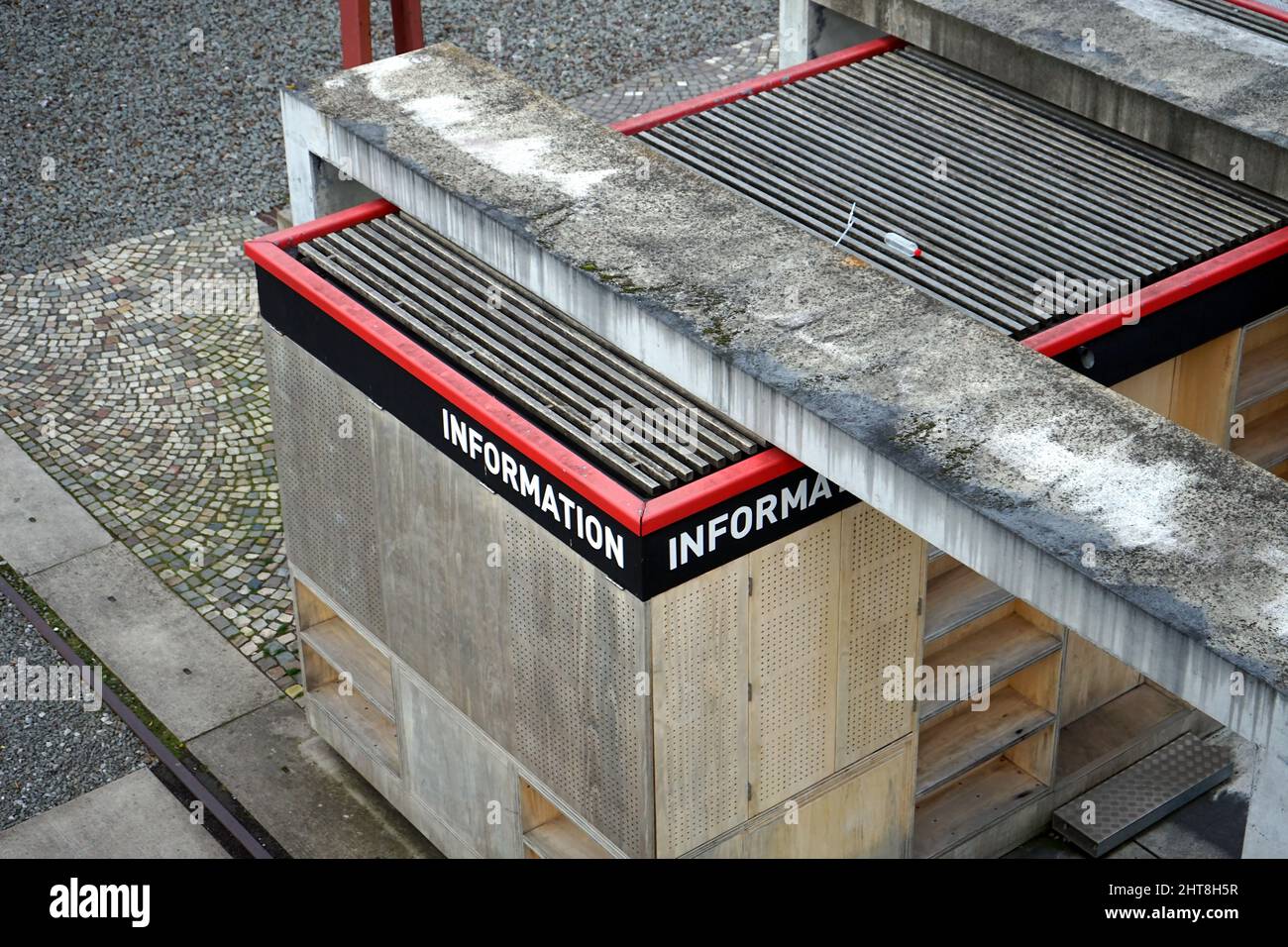 High-angle shot of a concrete building roof with adjacent structures ...