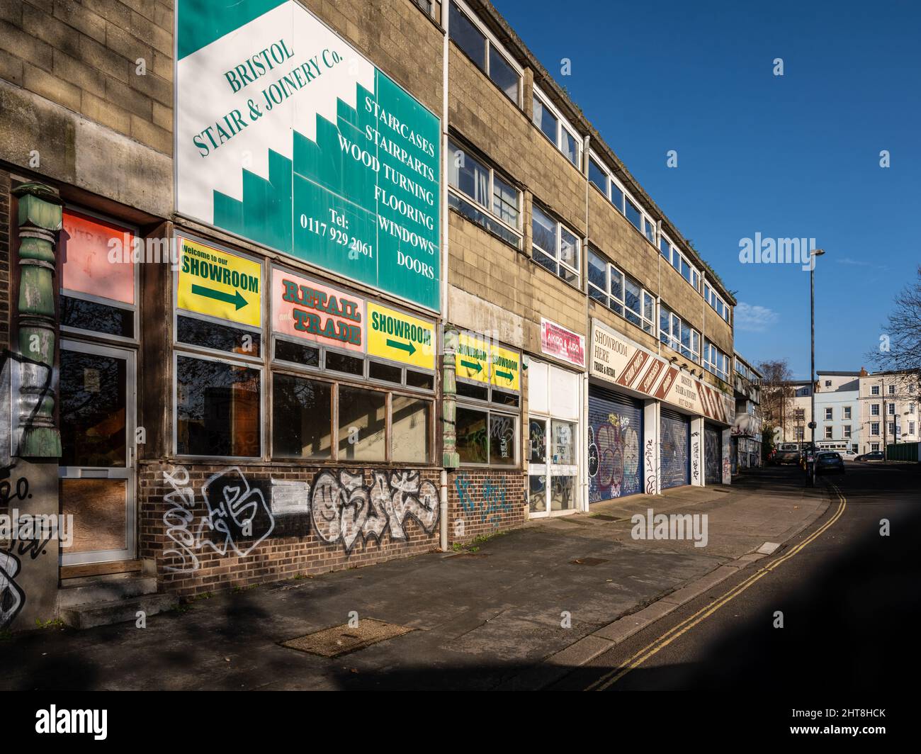 A showroom and office building stand abandoned and defaced on Unity ...
