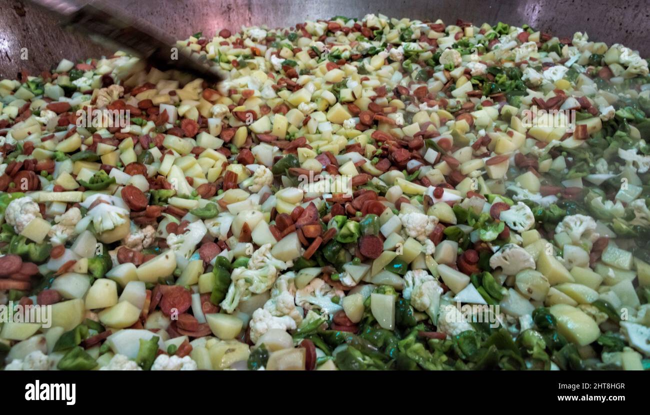 Preparing food to feed pilgrims in the kitchen of Gurudwara Bangla ...