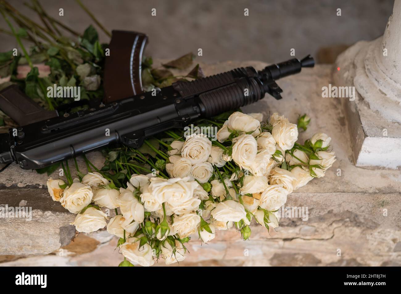 Automatic machine and a bouquet of small white roses Stock Photo - Alamy