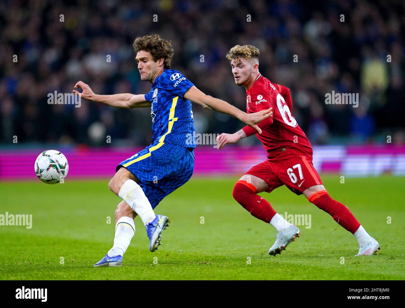 Chelsea's Marcos Alonso (left) and Liverpool's Harvey Elliott battle ...