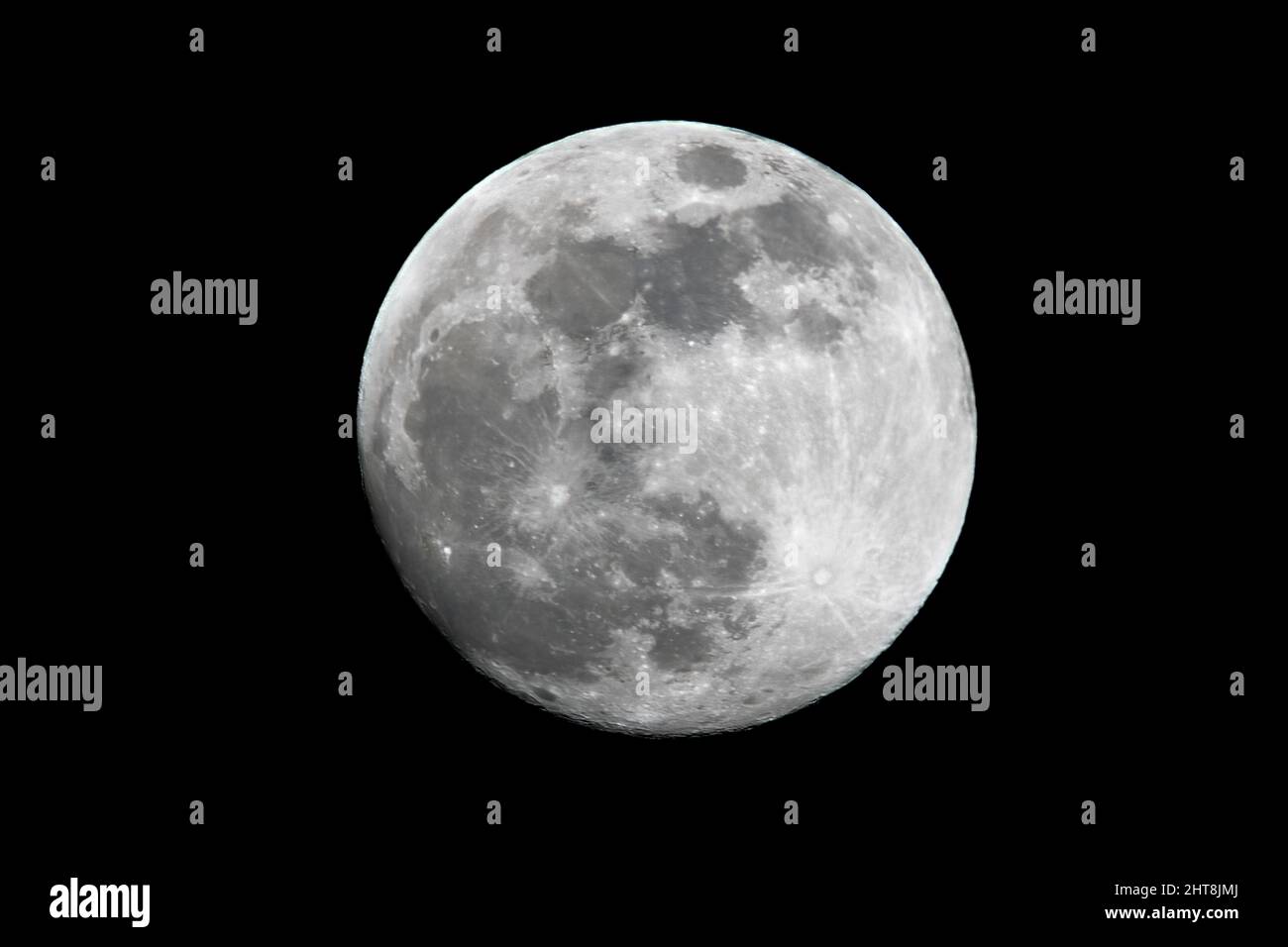 Zoomed in shot of the full moon on the dark night sky Stock Photo - Alamy