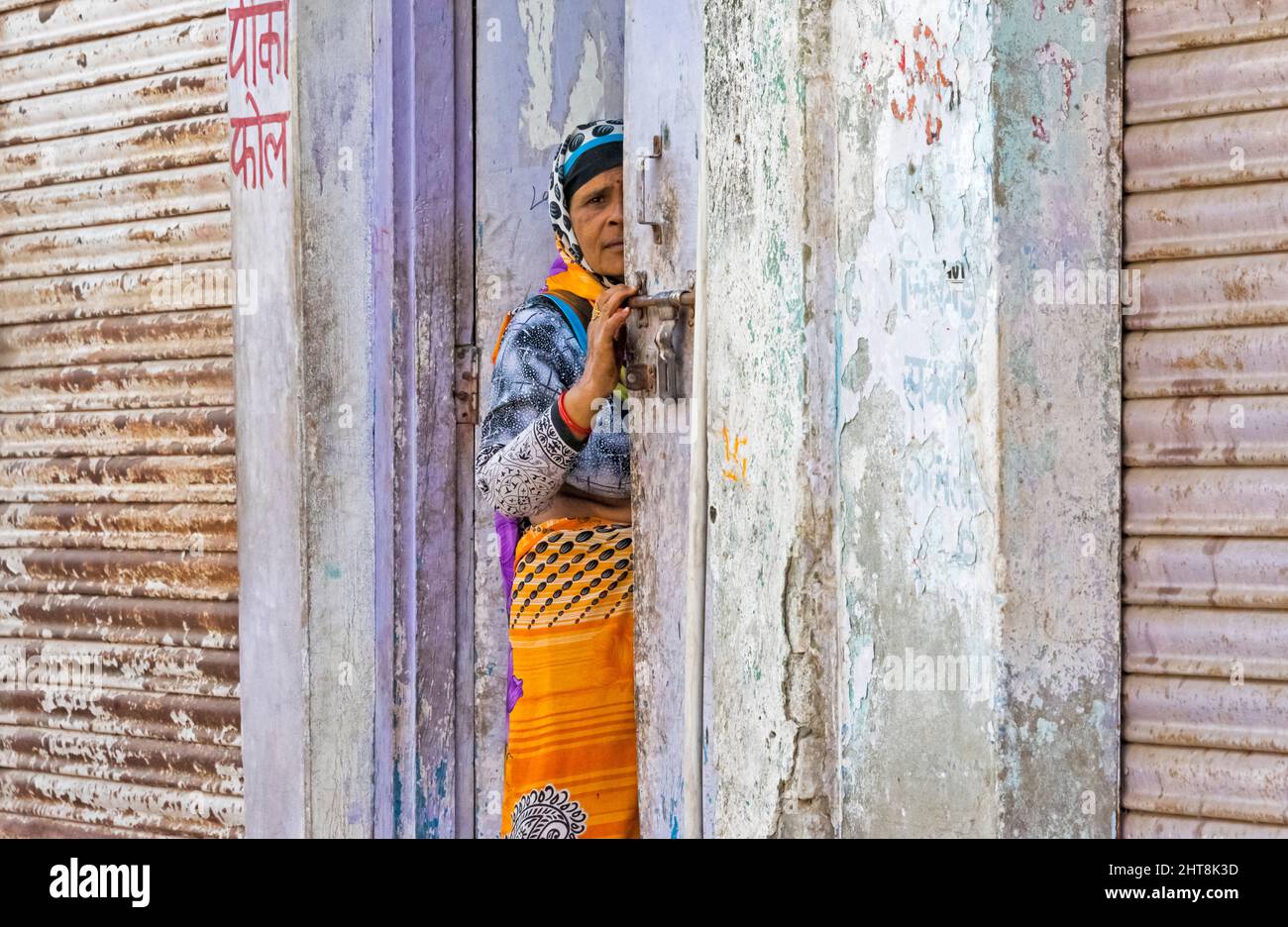 Woman behind a door, Baldeo, Mathura District, Uttar Pradesh, India ...