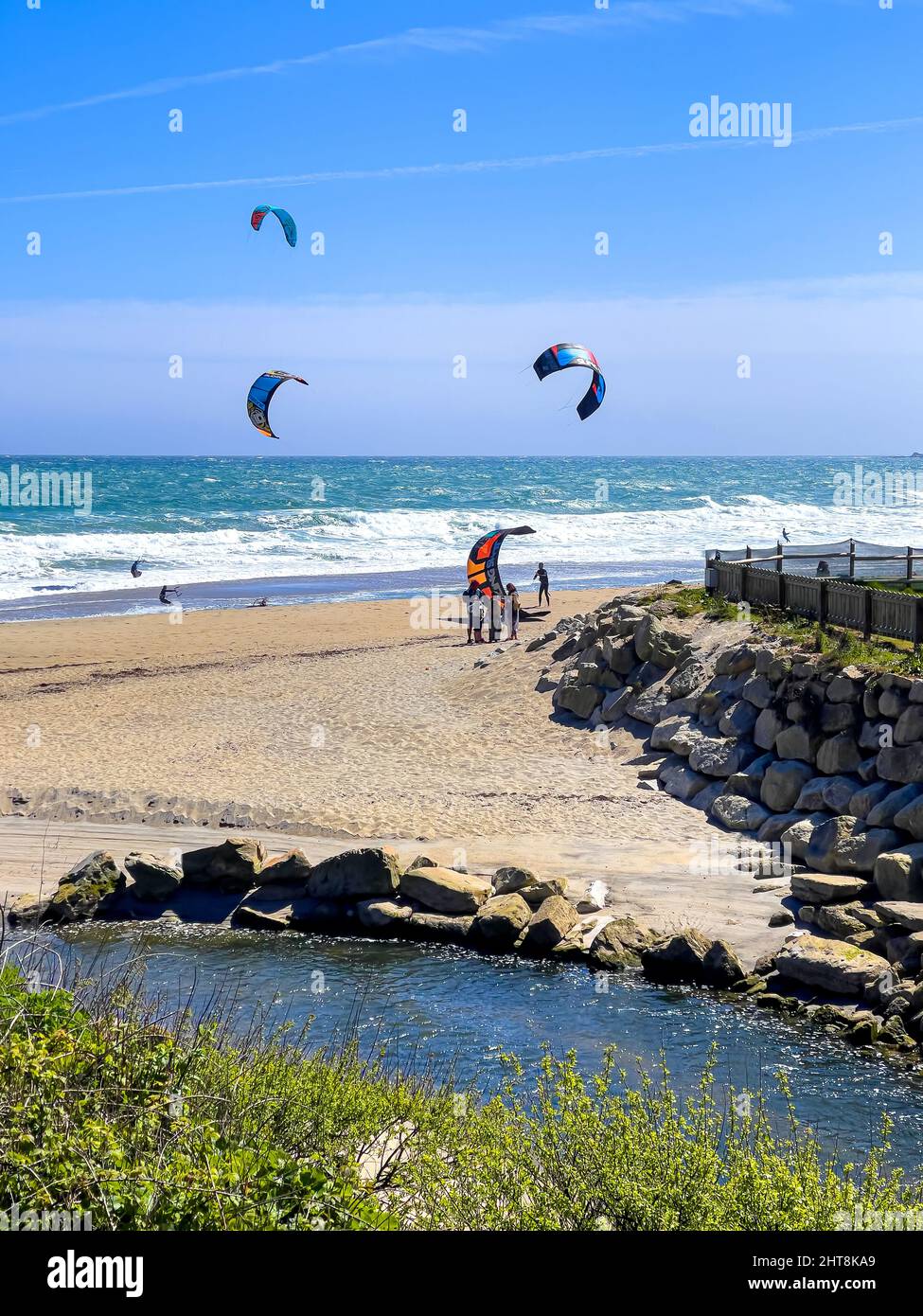 Vertical shot of group of kitesurfers on a Cornish Beach Stock Photo ...