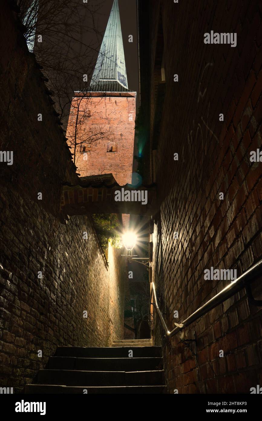 Vertical shot of a narrow staircase at night Stock Photo - Alamy
