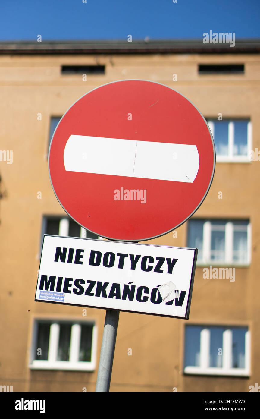 Closeup shot of a street sign "does not apply to residents". Poland ...