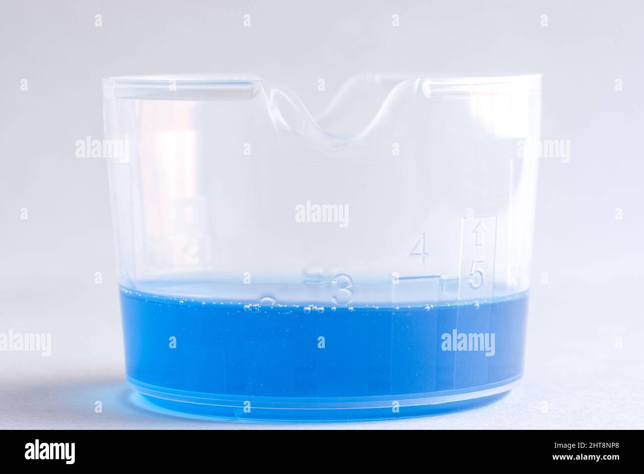 Liquid Laundry Soap in a Bottle Cap Stock Photo - Alamy