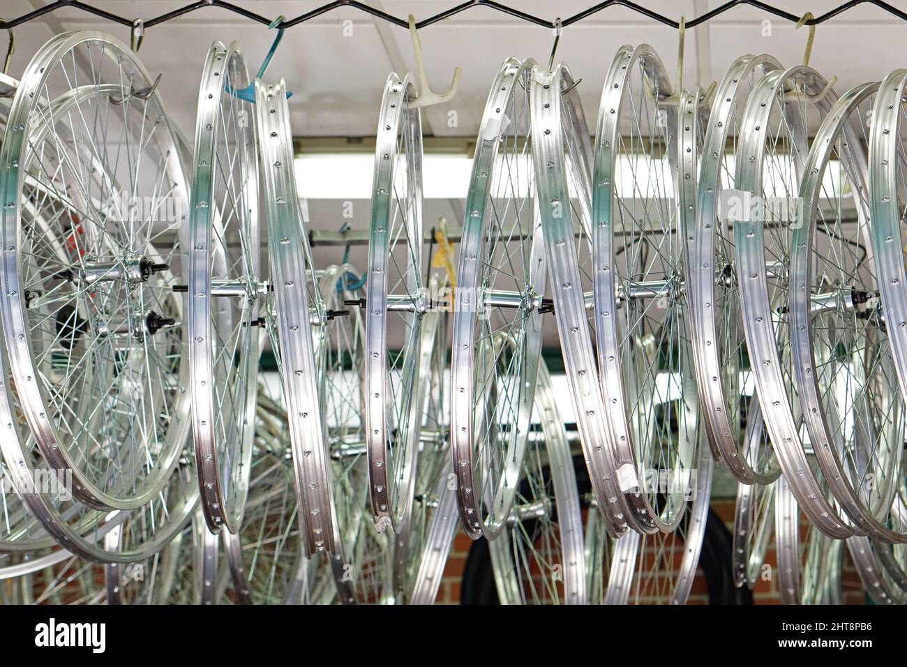 Many new wire spoked wheel rims for bicycles Stock Photo - Alamy