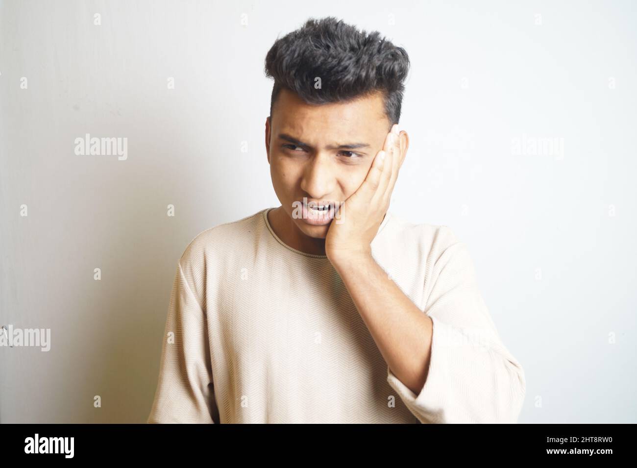 Young Indian man with a toothache Stock Photo - Alamy