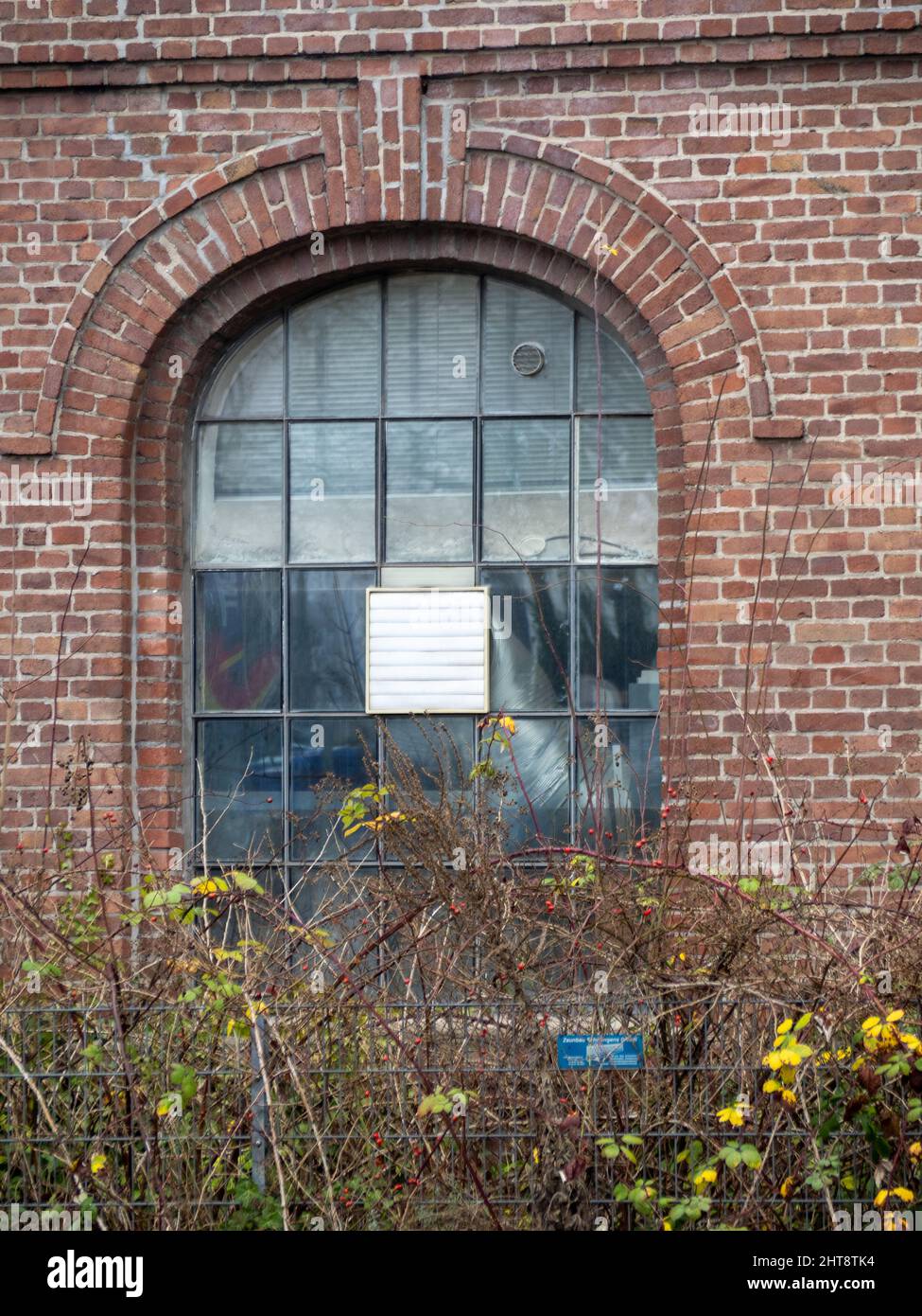 Vertical shot of a window on a brick building Stock Photo - Alamy