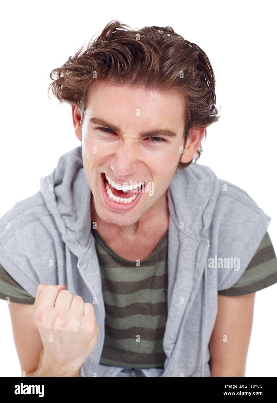 I finally did it. Young man doing a fist pump in an expression of ...