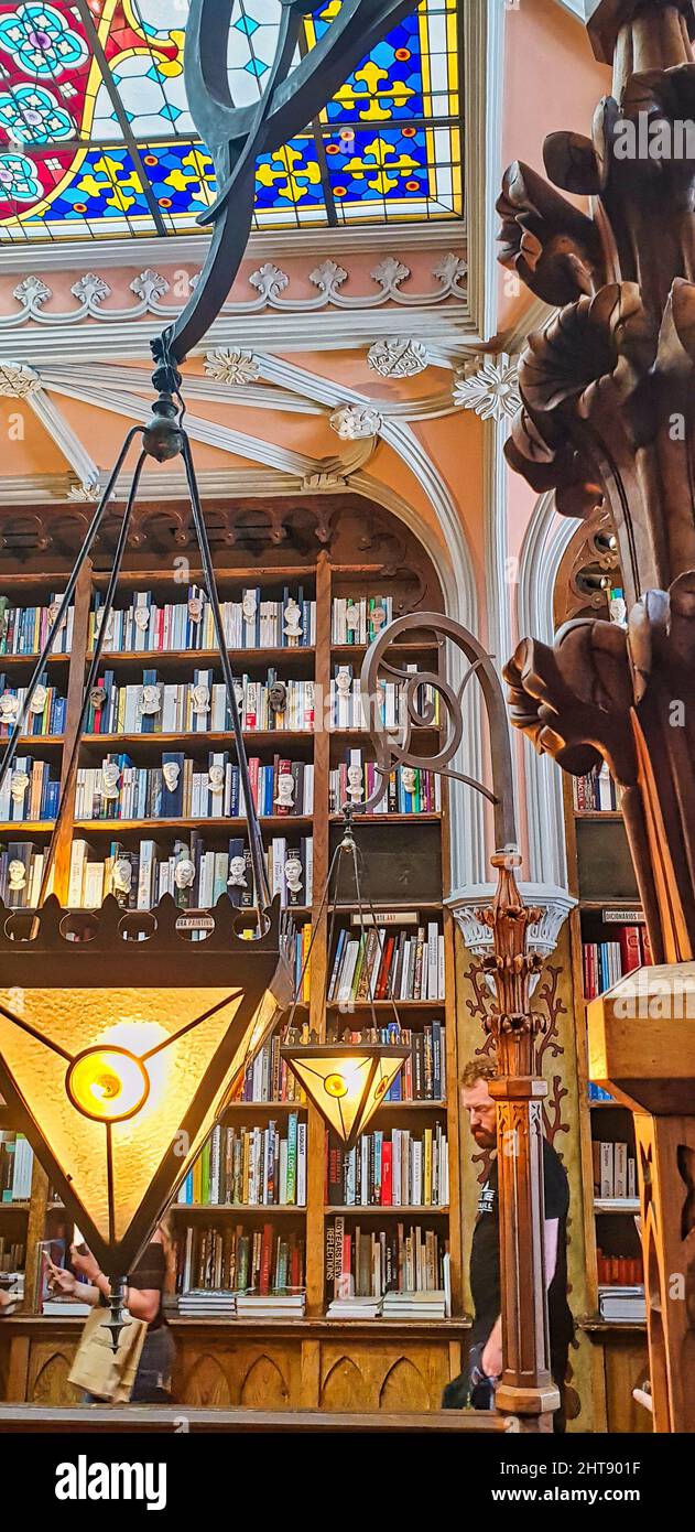 Vertical shot of a library full of books in a building with beautiful ...
