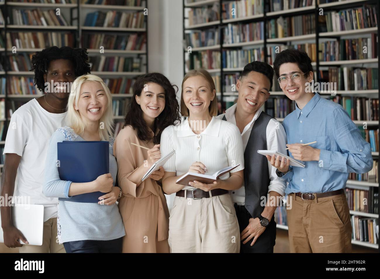 Portrait of smiling friendly smart millennial students Stock Photo - Alamy