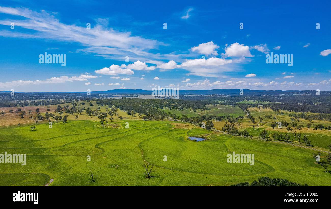 View of a big green field in Balancing Rock in Australia with a ...