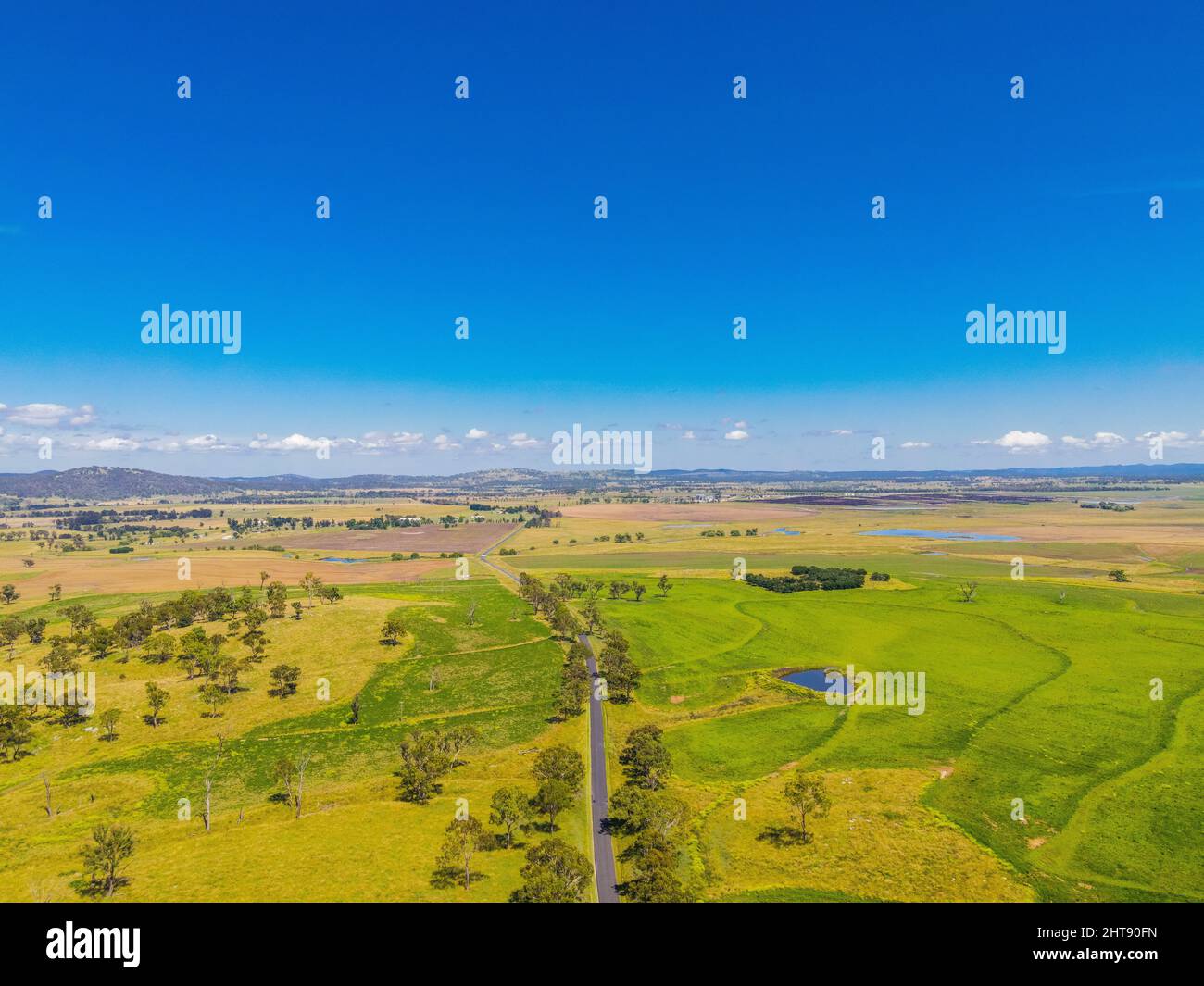 Big green field in Balancing Rock in Australia with a beautiful blue ...