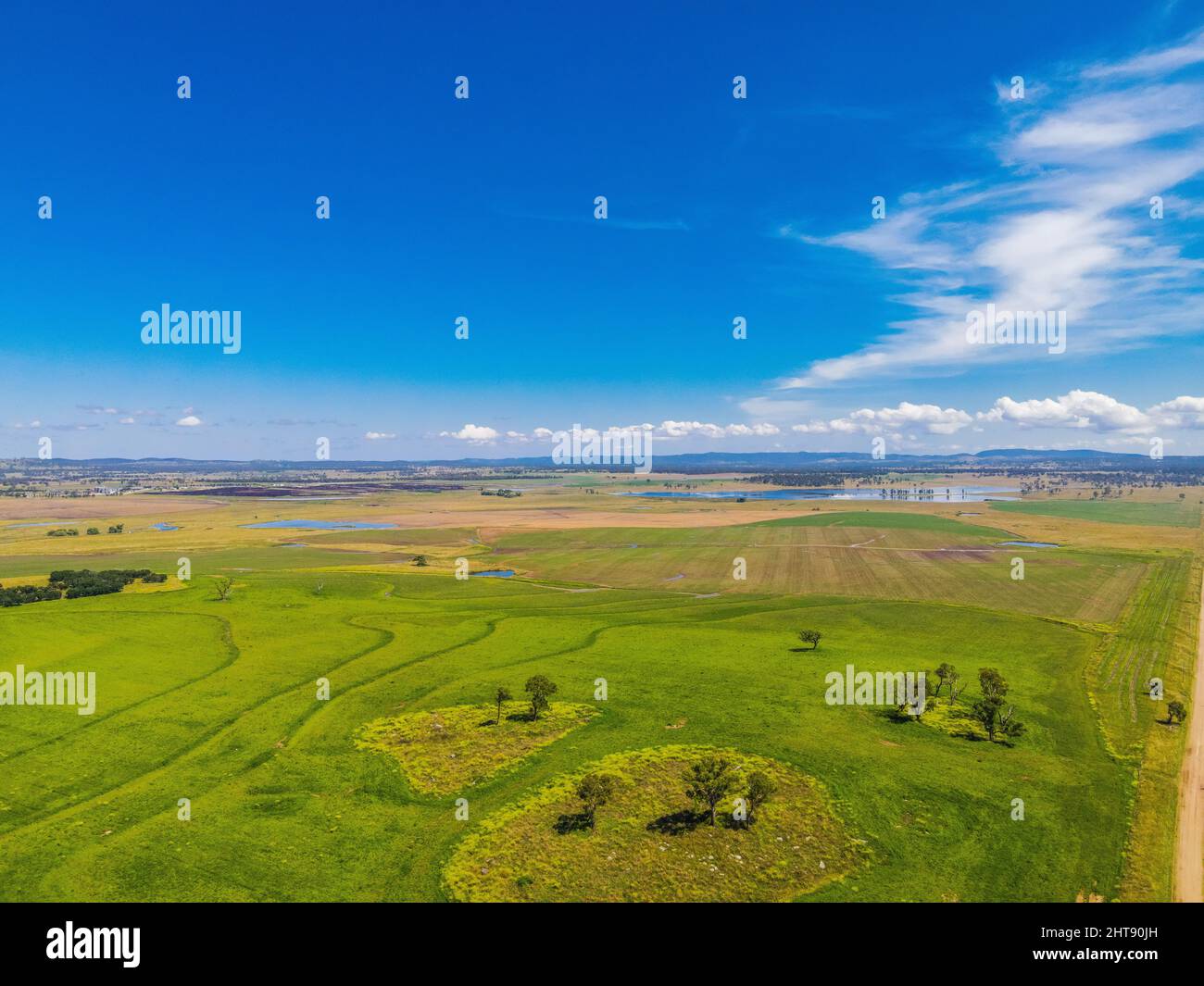View of a big green field in Balancing Rock in Australia with a ...