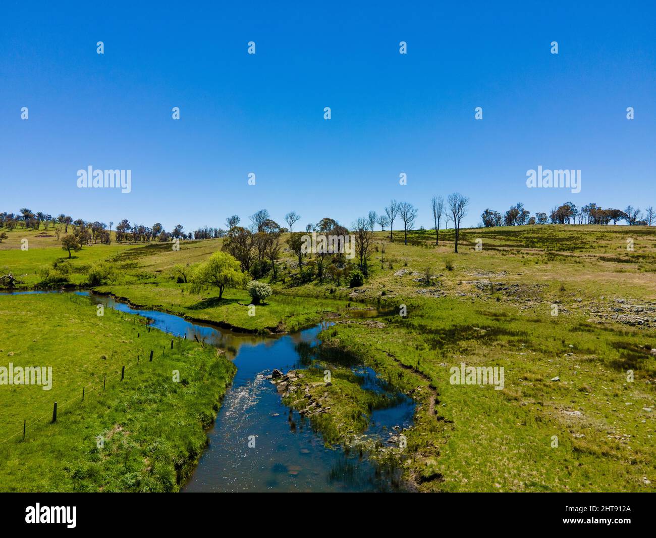 View of a big green field of the Beardy River with beautiful blue sky ...