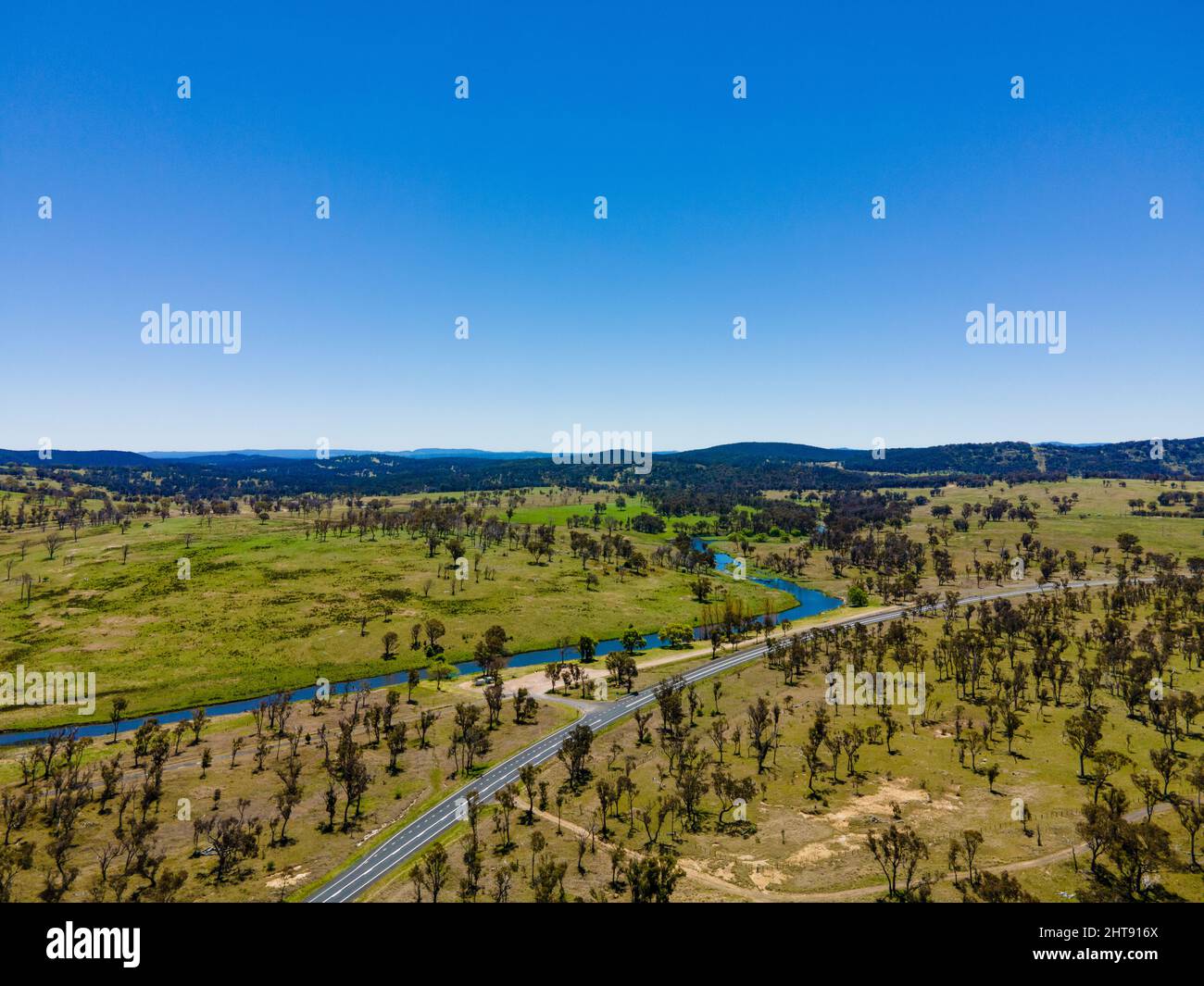 View of a big green field of the Beardy River with beautiful blue sky ...