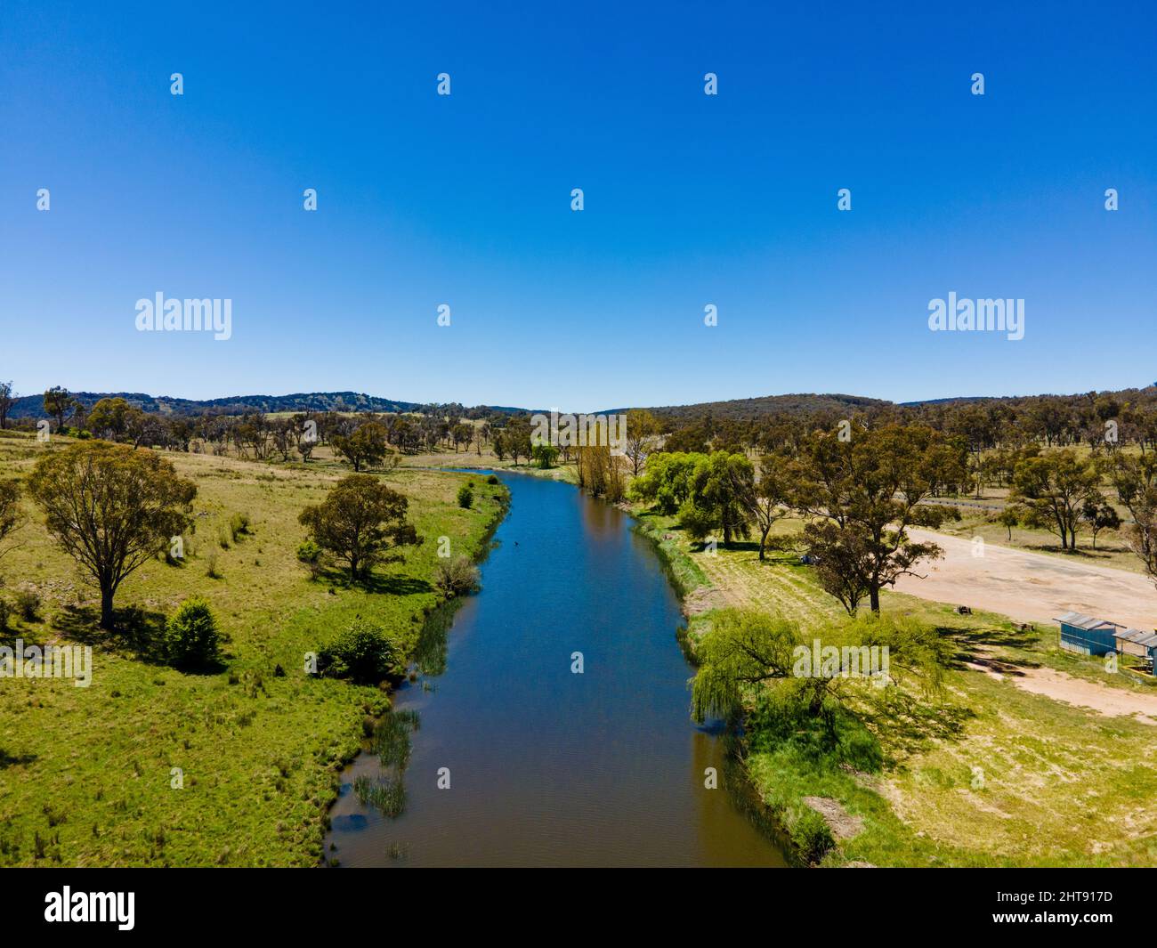 View of a big green field of the Beardy River with beautiful blue sky ...
